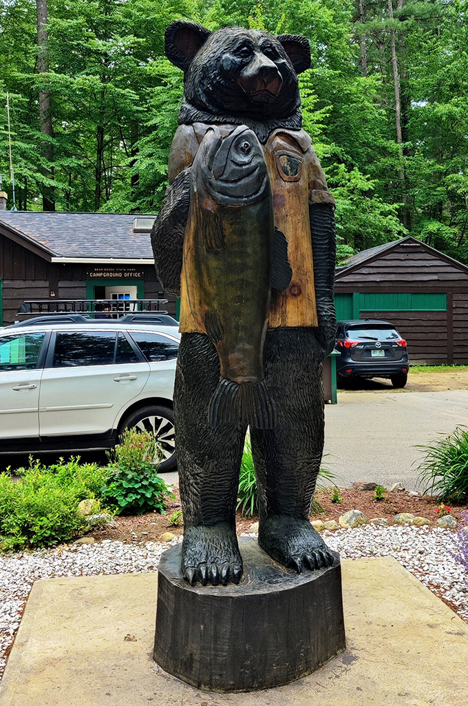 This wooden bear statue holding a fish welcomes campers with the kind of rustic charm that says, "Yes, you're definitely in New Hampshire now."