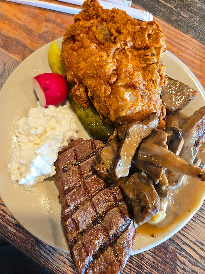 A plate that tells a story of indulgence&mdash;perfectly grilled steak, crispy fried chicken, and mushroom gravy that would make your grandmother nod in approval.