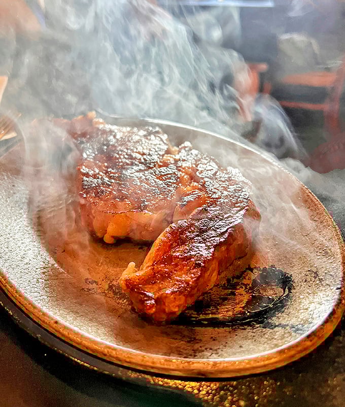Sizzling steak perfection that makes you want to write poetry. That steam isn't just vapor&mdash;it's applause rising from a perfectly cooked piece of beef.