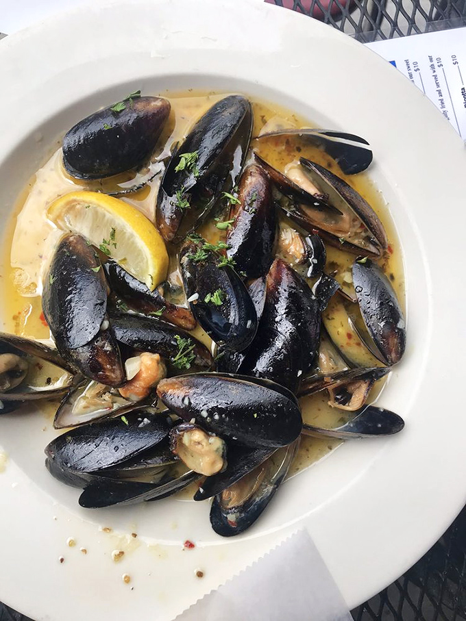 These Prince Edward Island mussels swim in a garlic white wine sauce so good you'll contemplate drinking it like soup.