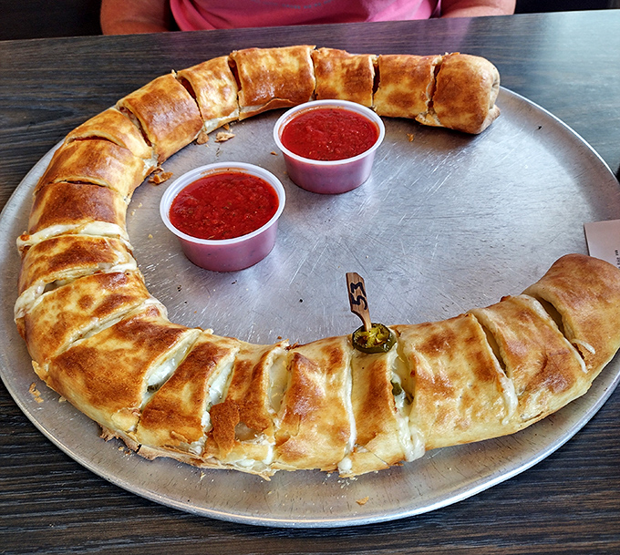 Behold the legendary stromboli&mdash;a golden crescent of dough cradling molten cheese and meats, served with marinara dipping pools.