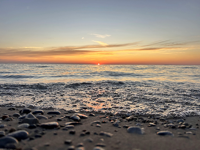 The sun takes its final bow of the day, painting the horizon in hues that would make Bob Ross reach for his palette knife.