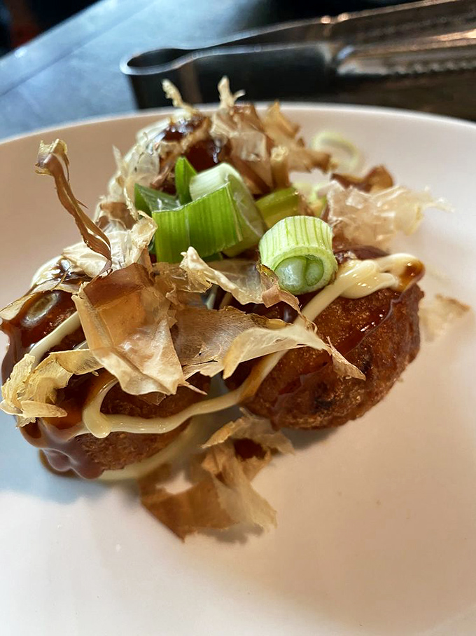 Takoyaki that's dressed to impress&mdash;crispy octopus balls topped with dancing bonito flakes that wave hello as you devour them.