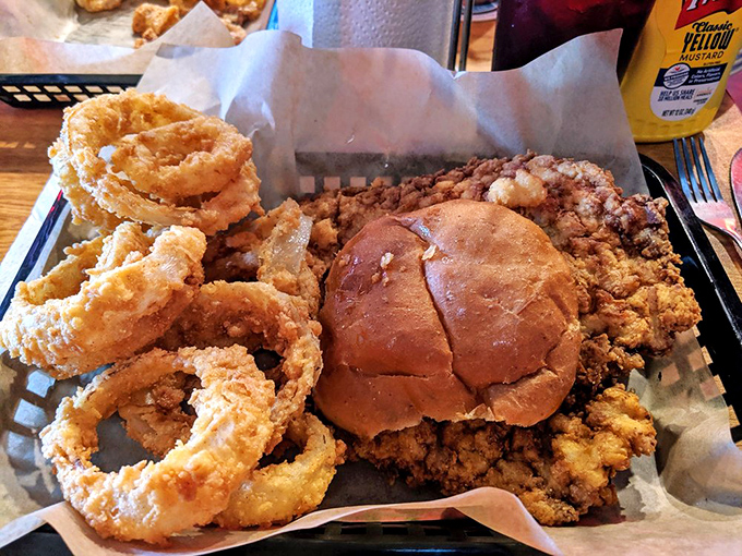 Golden-fried onion rings and a sandwich that's practically bursting at the seams &ndash; this is what happens when comfort food gets serious.
