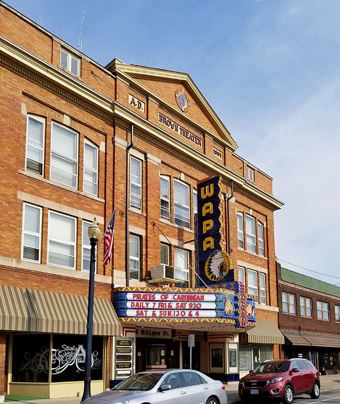 The historic Wapa Theatre's marquee lights up downtown like a beacon from another era, promising movie magic at prices that won't require a second mortgage.
