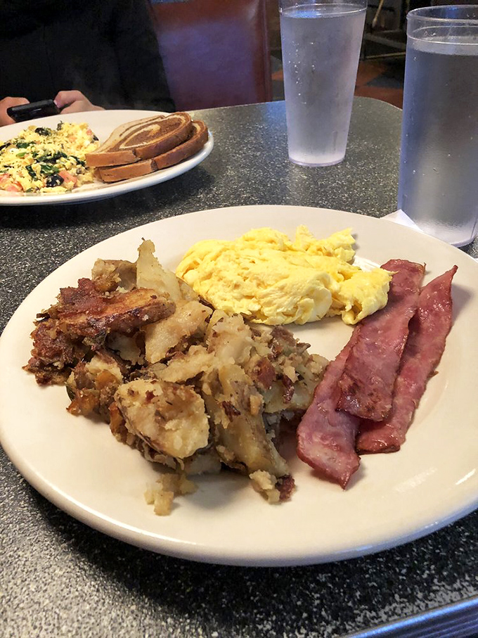Breakfast nirvana achieved: perfectly crispy potatoes, fluffy scrambled eggs, and that legendary turkey bacon that converts even the most devoted pork enthusiasts.