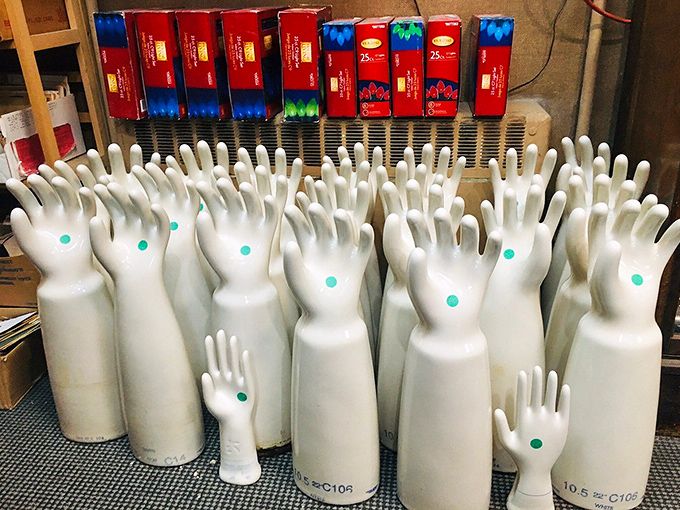 An army of vintage porcelain glove molds stands at attention, their green-dotted palms raised as if to say, "Pick me, I've got stories!"