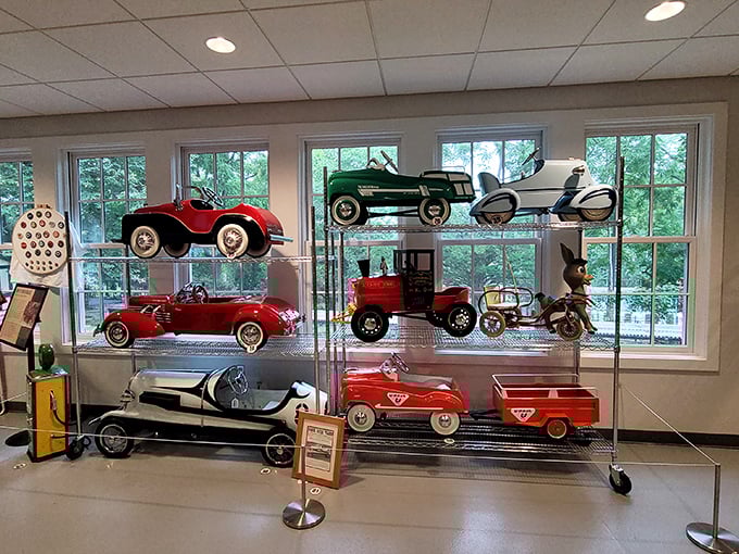 Childhood dreams in miniature! This delightful collection of vintage pedal cars proves that automotive passion starts young—no driver's license required.