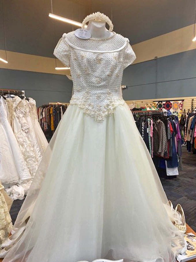 "Something borrowed, something new-to-you." Wedding dresses await their second chance at romance, bringing fairy tale dreams within budget-friendly reach.