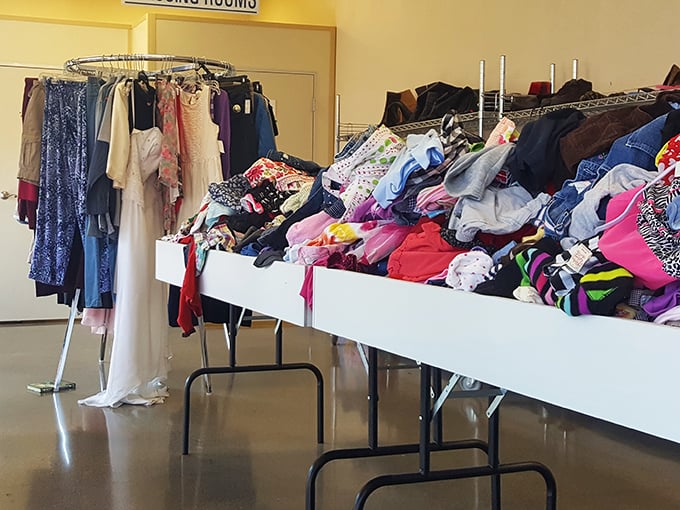 The women's clothing section: where yesterday's fashion statements get a second chance to be heard, all arranged in a chromatic symphony.