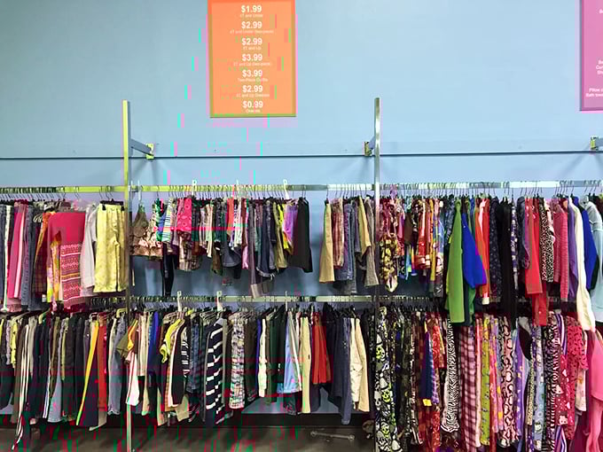 Women's clothing racks stretch endlessly, organized by color in a rainbow of fashion possibilities and forgotten trends.