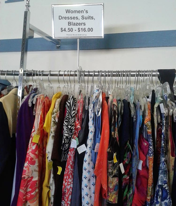 A rainbow of possibilities hangs in perfect order. Each dress tells a different story&mdash;from corporate boardrooms to summer weddings&mdash;all waiting for their next chapter.