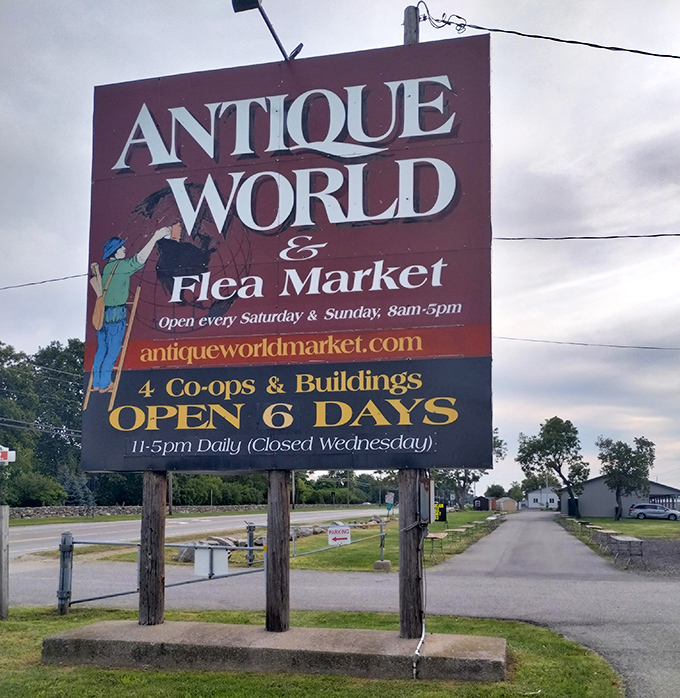 This cheerful roadside sign promises six days of antique adventures in upstate treasure territory.