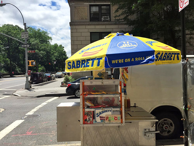 The classic blue umbrella setup that's fed more New Yorkers than most fancy restaurants.