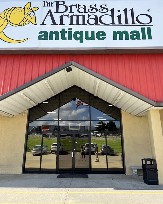 The Brass Armadillo's quirky yellow mascot stands guard over this red-walled treasure trove of possibilities.