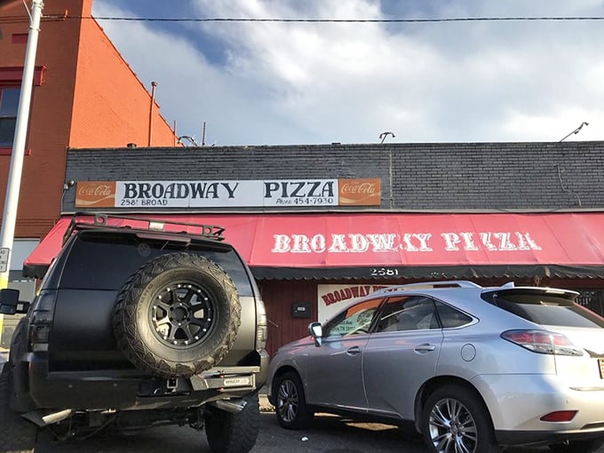 Classic red awning pizza joints like this have been feeding neighborhoods since your grandparents' time.