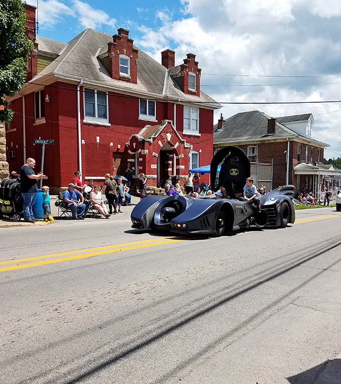 Holy roadsters, Batman! Buckhannon's streets come alive with caped crusaders while locals enjoy the show from historic front-row seats.