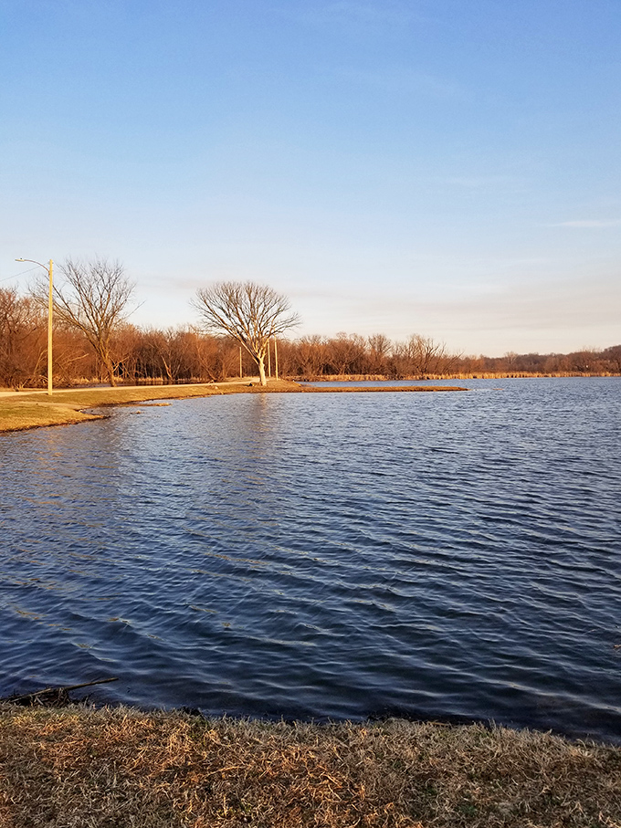 Cherryvale's quiet lake reflects the sky like nature's own mirror in this hidden Kansas gem.
