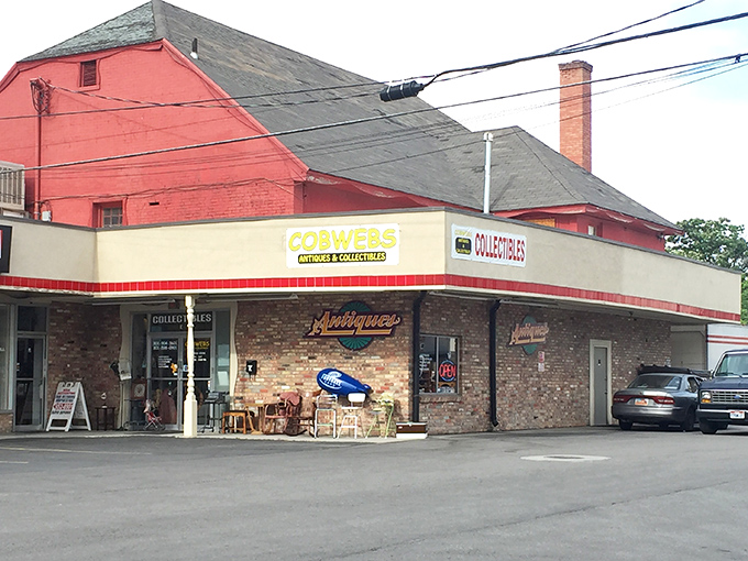 Cobwebs' charming brick facade and retro signage hint at the nostalgic journey waiting just beyond those doors.