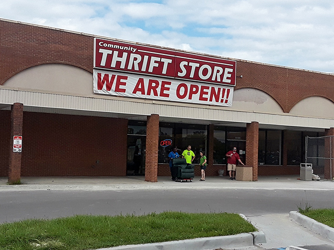 "WE ARE OPEN!!" shouts the Community Thrift Store sign, as if it can barely contain its excitement about the deals inside.