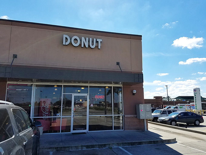 Sometimes the most unassuming storefronts hide the greatest treasures. This simple "DONUT" sign is like a secret handshake among locals who know what's good.