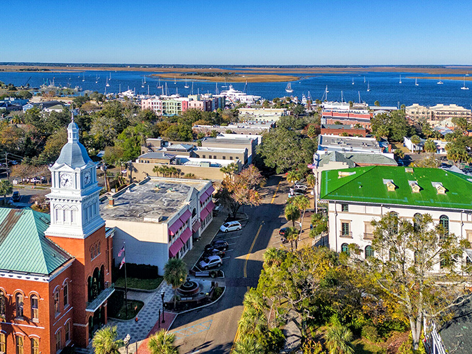 Where the river meets the sea, this aerial view captures the peaceful coexistence of nature and neighborhood.