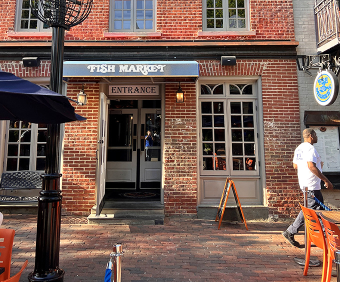 The historic brick facade of Fish Market Restaurant whispers tales of Alexandria while promising fresh catches inside.