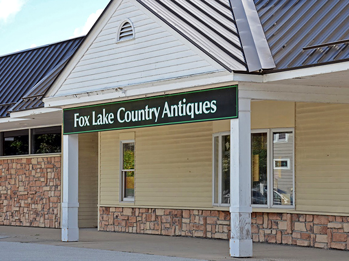 Country charm meets vintage paradise. Fox Lake Country Antique Mall's stone facade welcomes treasure hunters with rustic Wisconsin appeal.