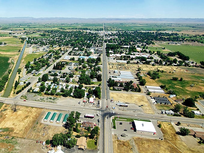 Aerial view of Gooding's historic downtown features tree-lined streets, residential buildings and budget-friendly businesses. A place where your wallet feels heavier just by crossing the city limits.