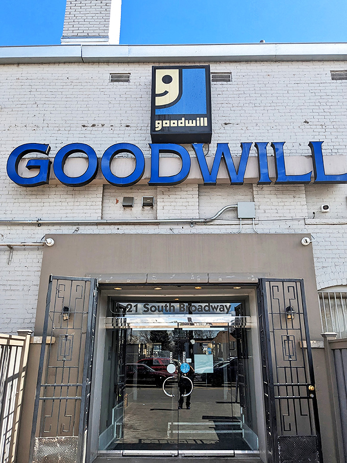 Goodwill's Broadway location stands like a white brick castle of secondhand treasures, complete with impressive entrance doors.
