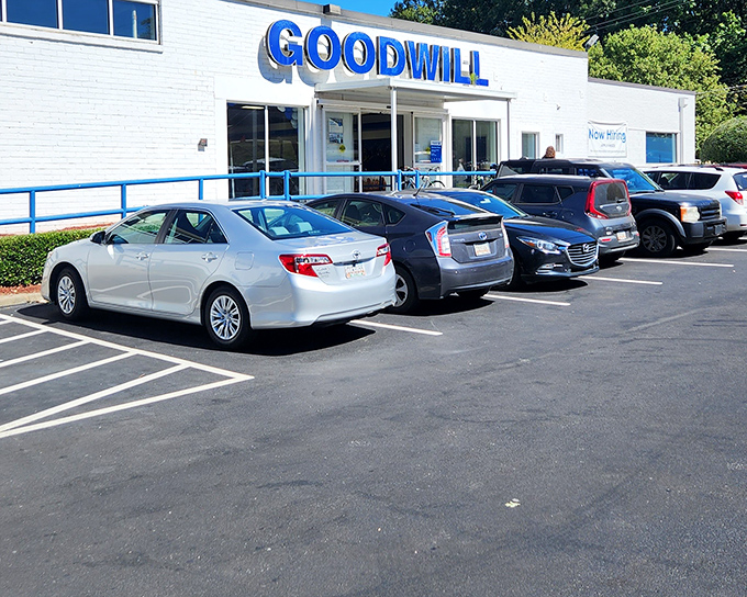 That blue awning signals serious thrift shopping ahead, where forty dollars feels like a fortune.