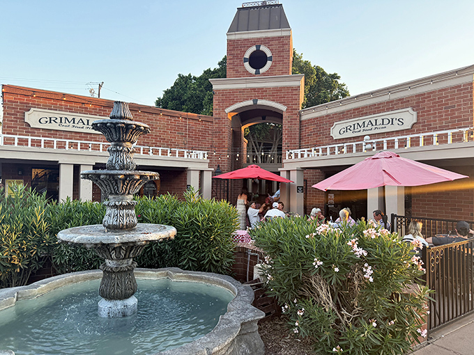 Brick elegance and fountain serenades create the perfect backdrop for coal-fired pizza perfection.