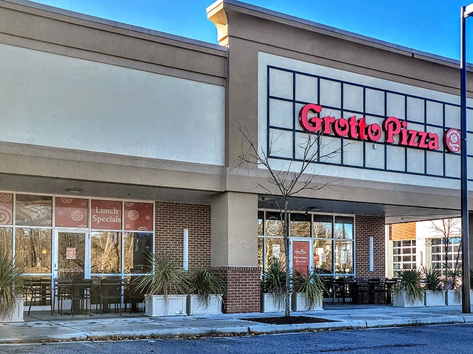 Grotto Pizza's bold red sign signals pizza paradise ahead - no treasure map required.