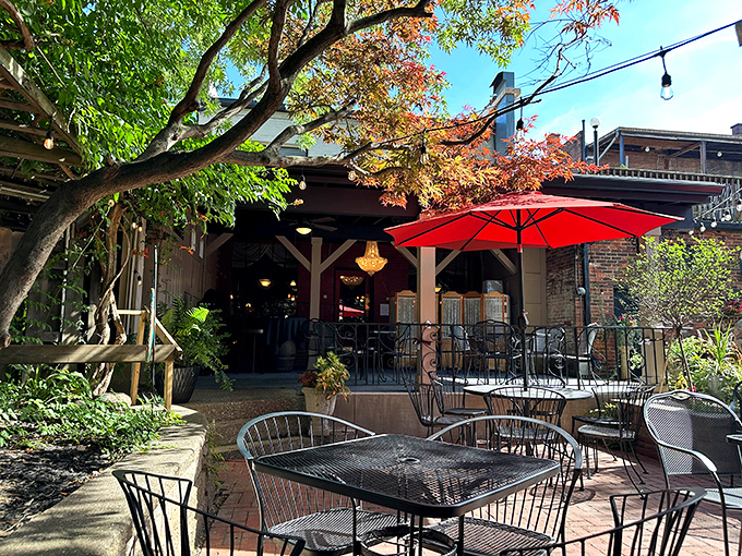 Under the shade of red umbrellas and leafy branches, Guarino&rsquo;s patio offers a timeless setting for leisurely meals and lively conversation.