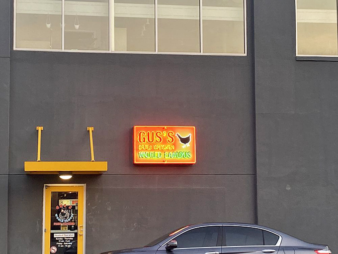 Gus's neon sign glows like a beacon in the night, guiding hungry pilgrims toward spicy, crispy salvation.