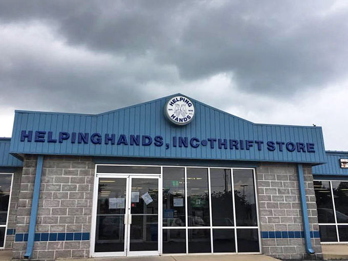 Helping Hands' blue awning signals a treasure trove where your purchases help neighbors in need.