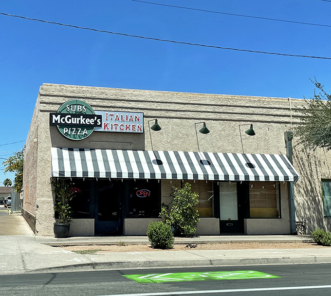 Classic striped awnings signal traditional deli values, where subs are built to satisfy and portions reflect old-fashioned generosity.