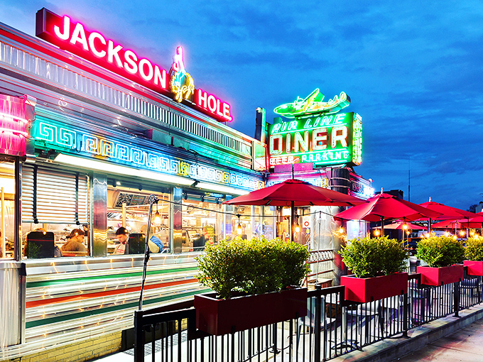 Neon signs and aluminum siding create the perfect backdrop for airport-adjacent breakfast adventures.
