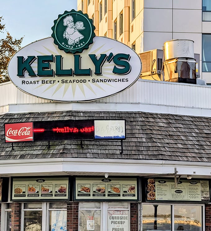 Kelly's green and white sign is like a lighthouse for hungry beachgoers seeking the perfect fried clam experience.