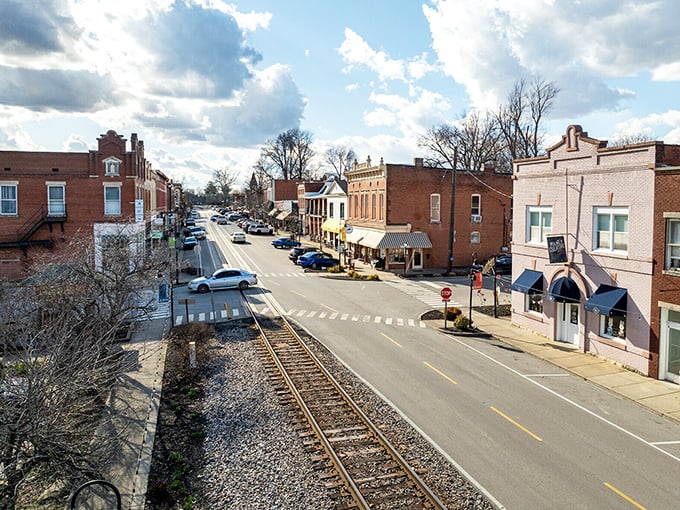 Those railroad tracks run right alongside Main Street like they're part of the town's daily conversation.