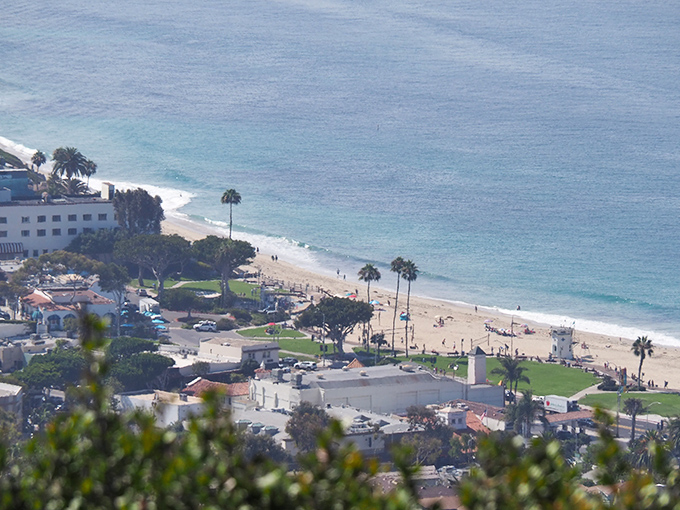 Hillside homes cascade down to the ocean like they're competing for the best sunset viewing spot available.