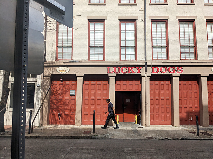 Behind those historic red doors lies a New Orleans hot dog tradition that's outlasted countless Bourbon Street hangovers.