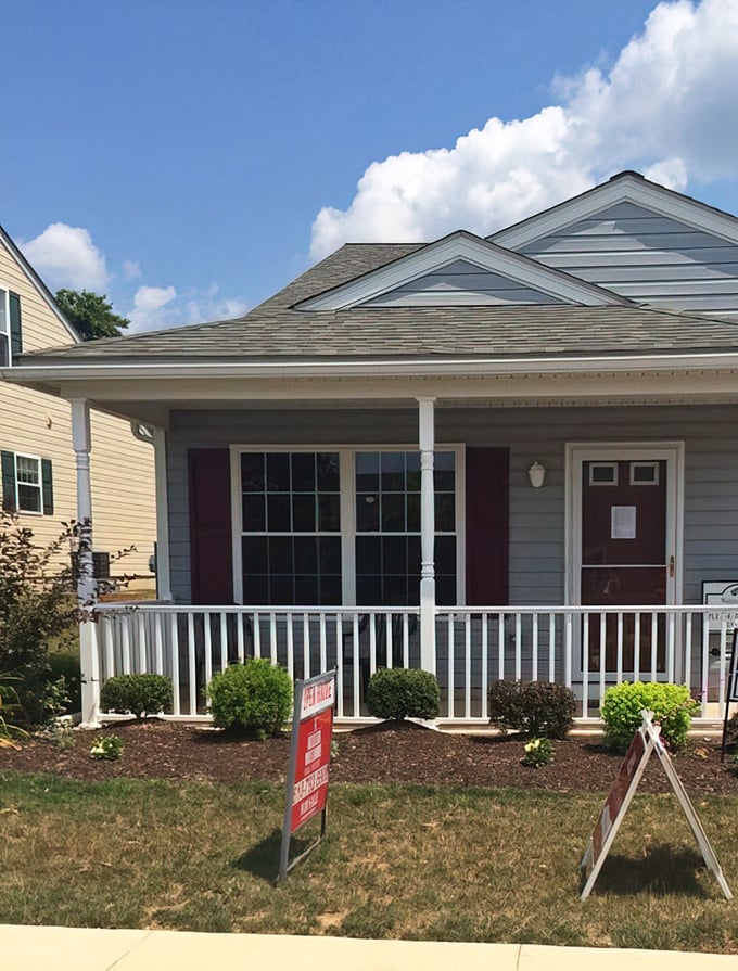 Gray siding, burgundy shutters, and a pristine porch—Manatawny Village homes have more curb appeal than most vacation spots I've paid good money for.