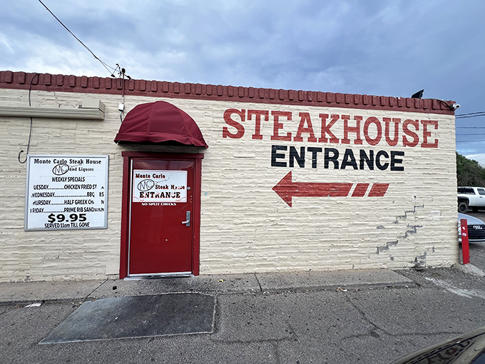 Monte Carlo's no-nonsense exterior is like that friend who doesn't brag but always delivers. Red door, white walls, steak paradise.