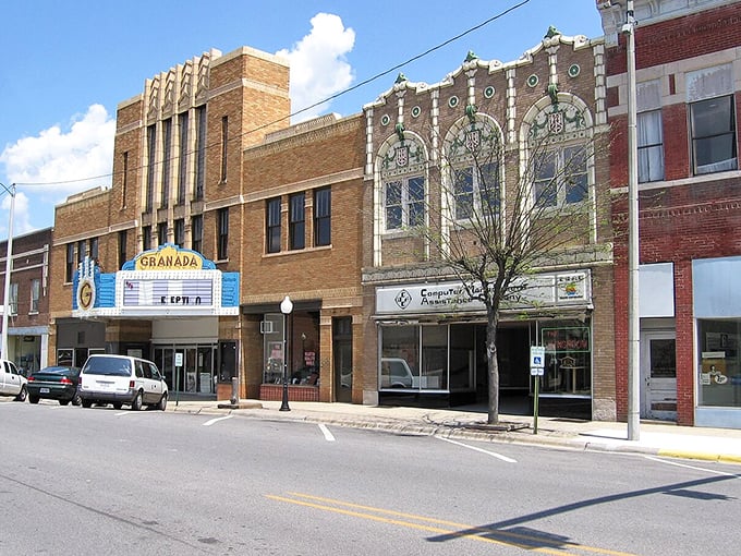 Show-stopping savings! Mount Vernon's Granada Theatre marquee still lights up the night, while nearby shops keep prices firmly in the "I can afford that" zone.