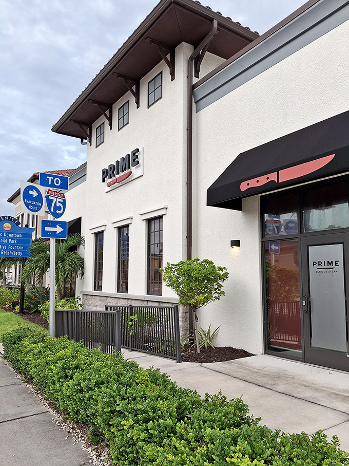 Clean lines and understated elegance hint at the perfectly prepared prime rib waiting just beyond those modern doors.