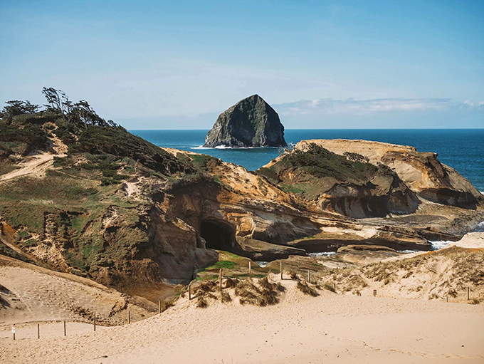 Pacific City's Haystack Rock stands majestically while beachgoers enjoy Oregon's most adventure-ready stretch of sand.