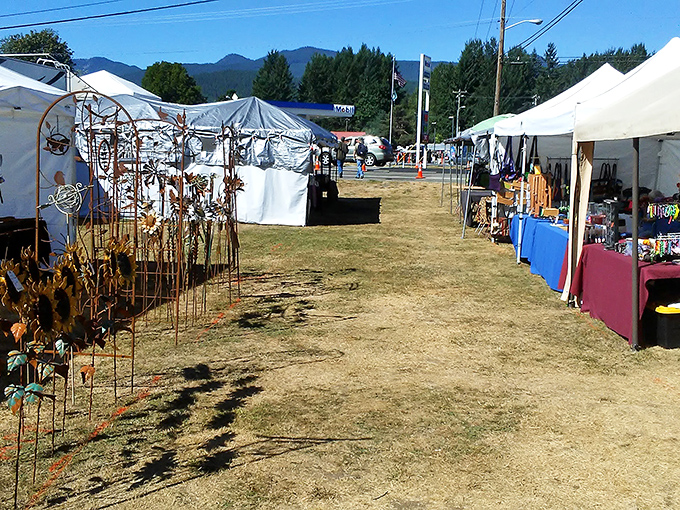 Mountain air and metal sculptures create an artistic treasure hunt that feels like outdoor gallery shopping.