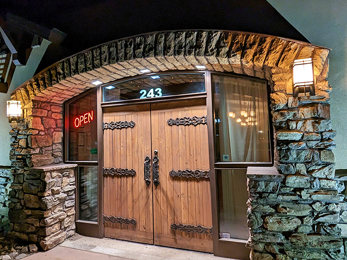 Medieval castle doors open to reveal pizza paradise hidden in Monument's charming downtown district.