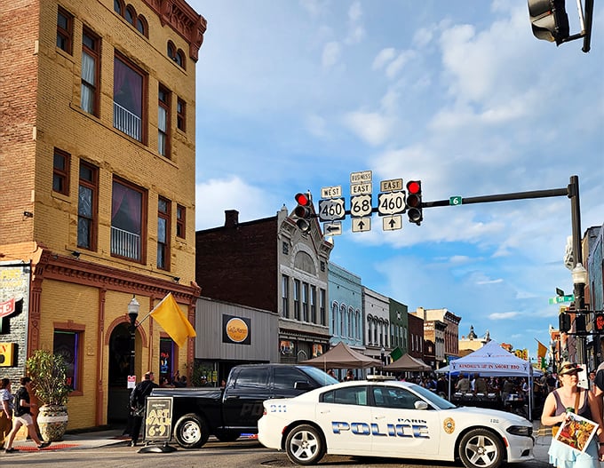Route marker rendezvous! Paris's historic brick beauties stand guard as the local police keep watch over what looks like the world's most charming traffic jam during festival season.